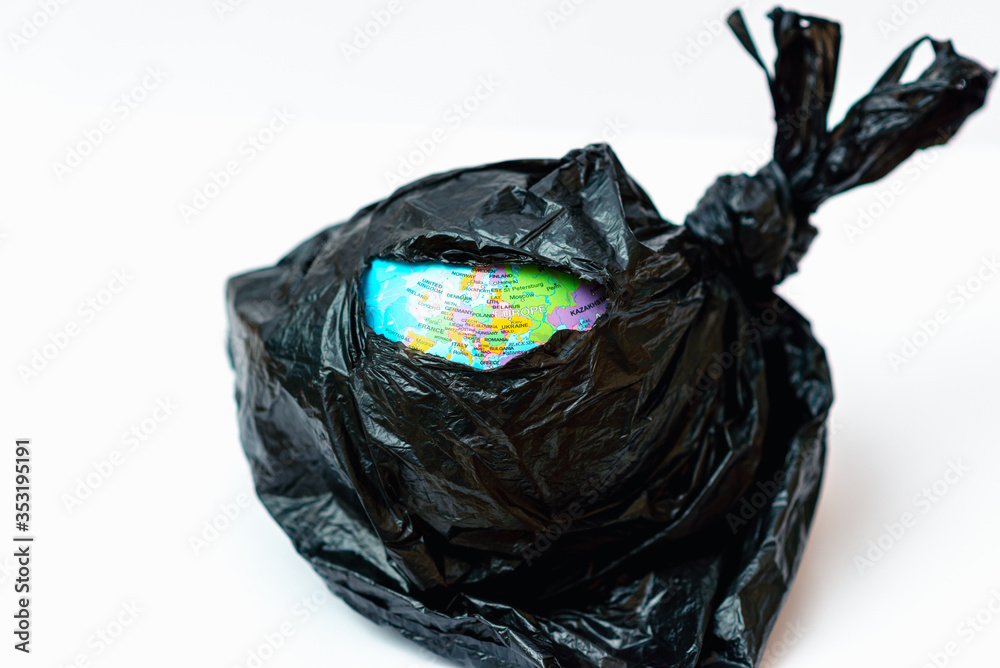 World Globe inside plastic bag you can see in hole different parts of ...