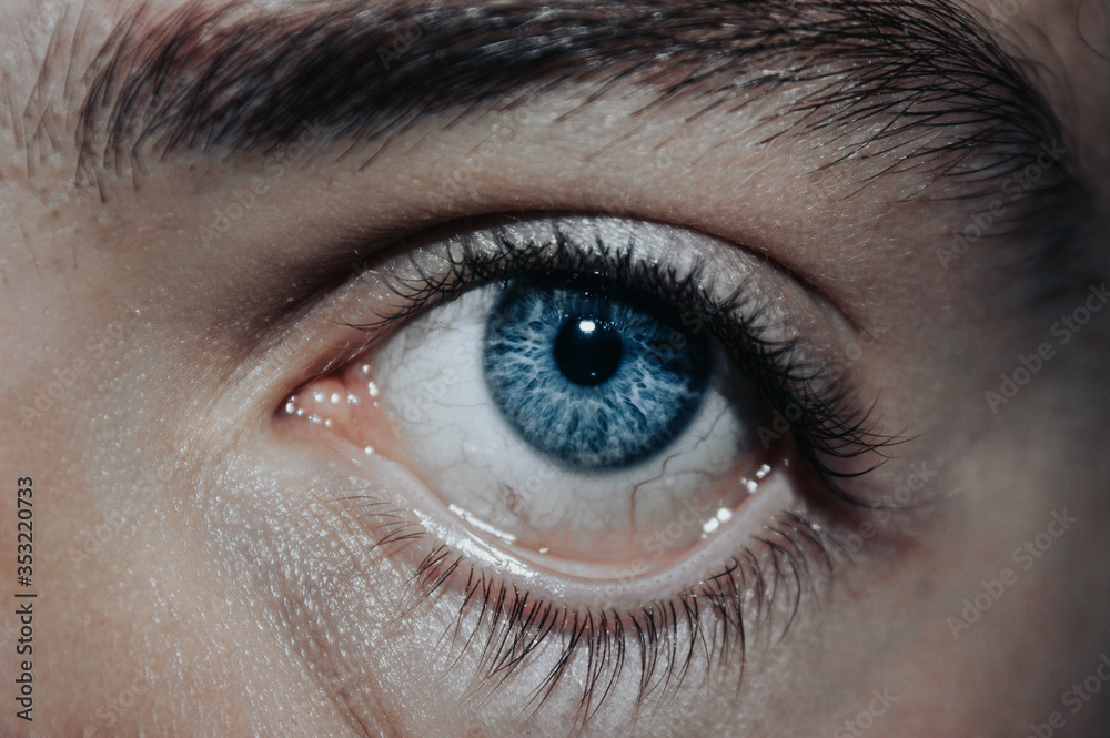 Close up of Finger opening the Eye. Blue Eye with Veins. Ophtalmology ...