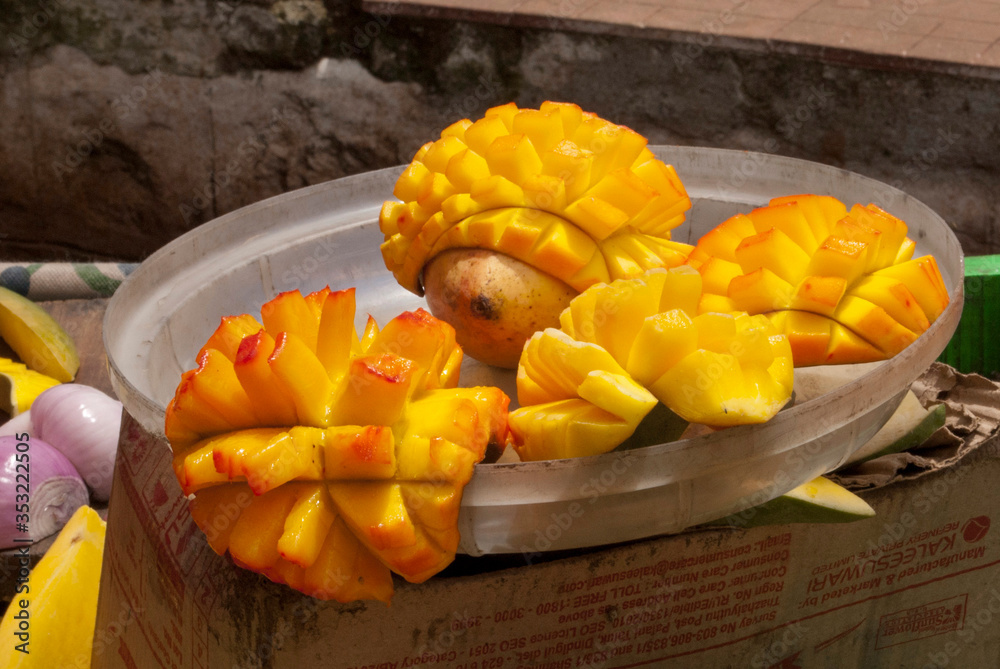 street food in India sliced mango with chilli powder Stock Photo ...