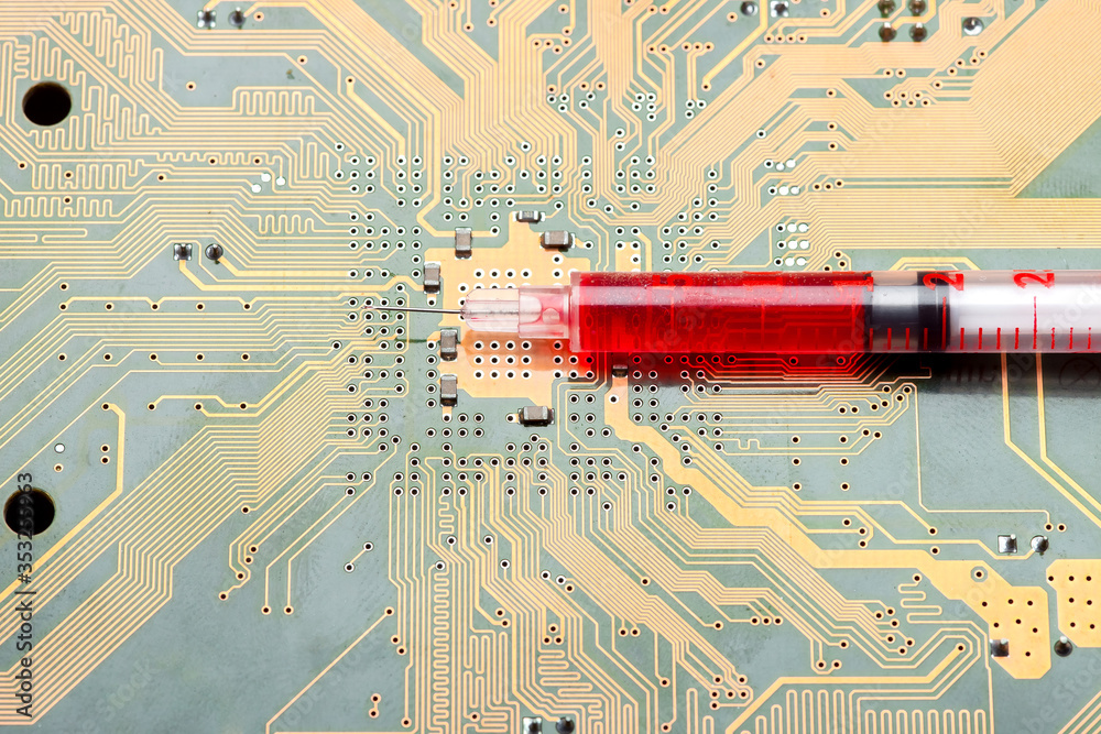 syringe with needle filled medicinal product lies on silicone printed ...