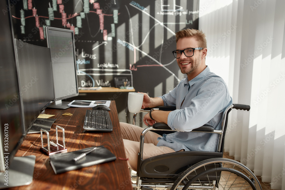 Enjoying his work. Portrait of young successful male trader in a ...