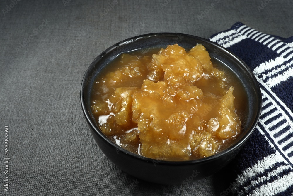 Traditional plain fish maw soup in the bowl. Famous luxury seafood menu ...