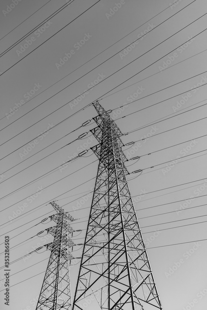 High power electricity poles connected to smart grid at clear sky ...