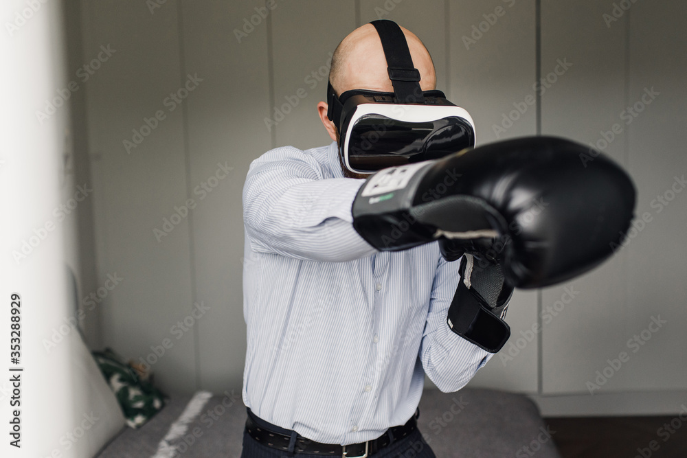Augmented 3D world. Cyber sportsman boxing gloves. Man play game in VR ...