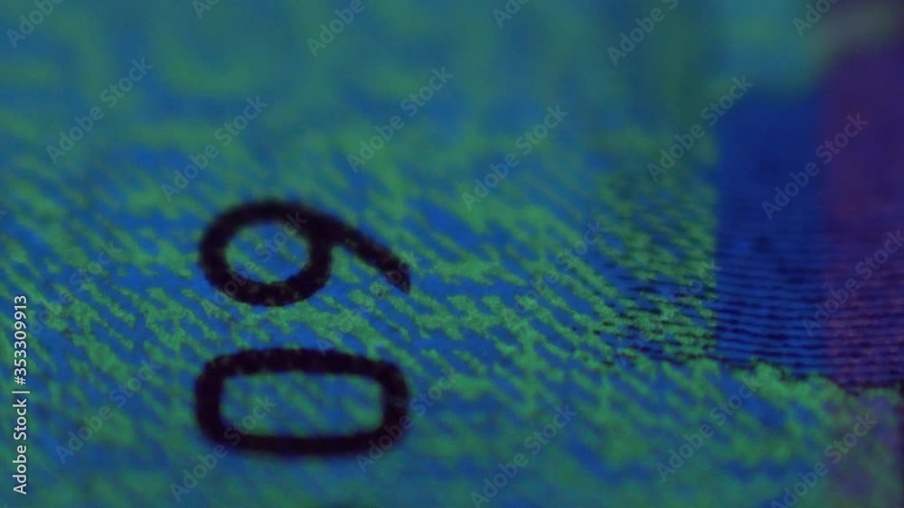 Financier banker checks paper money in ultraviolet light. Extreme close ...