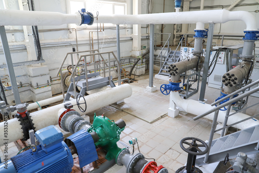 Modern pumping station at the water intake. Pipes, electric motors ...