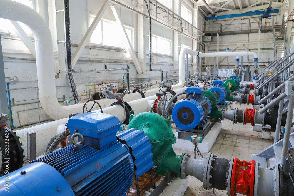 Modern pumping station at the water intake. Pipes, electric motors ...