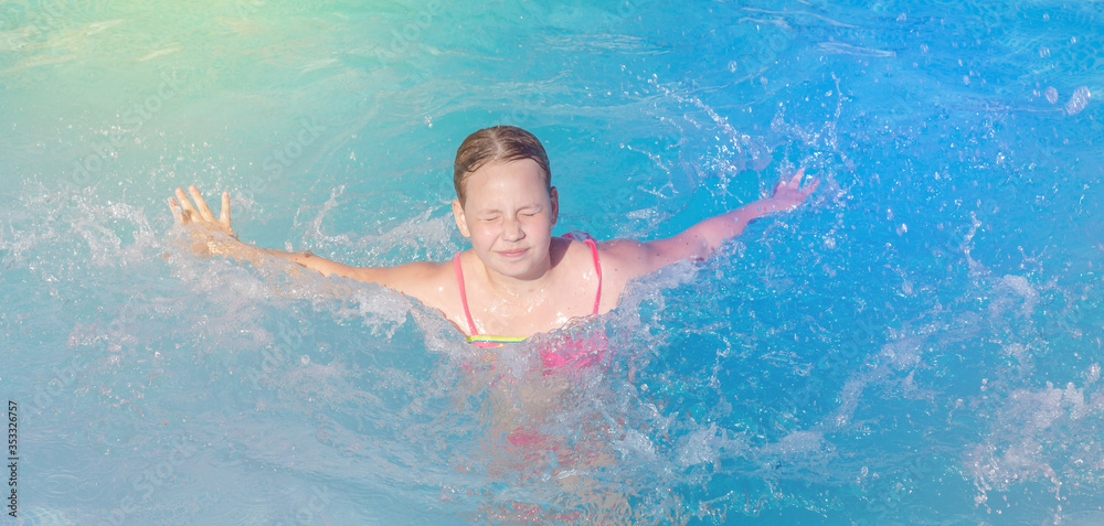 the girl can't swim and is afraid of drowning. Child having fun in ...