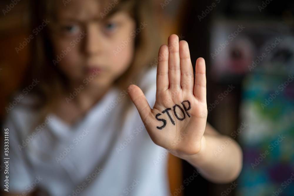 The child makes a stop gesture with his hand. Stop domestic and child ...