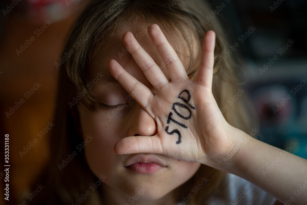 The child makes a stop gesture with his hand. Stop domestic and child ...