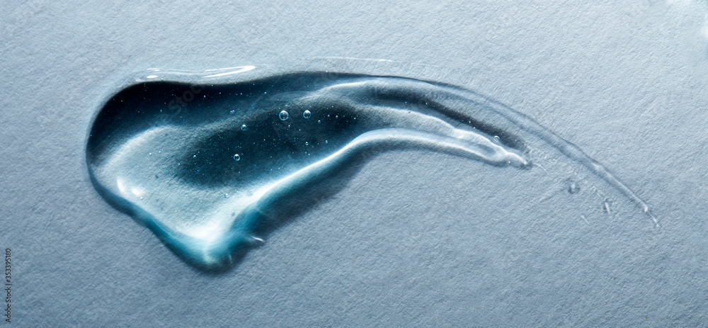 Transparent gel with bubbles close-up. Smear of face gel cream. The ...