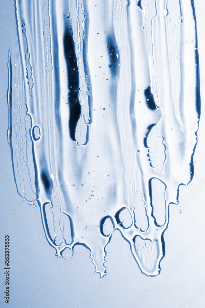 Foto de Transparent gel with bubbles close-up. Smear of face gel cream ...