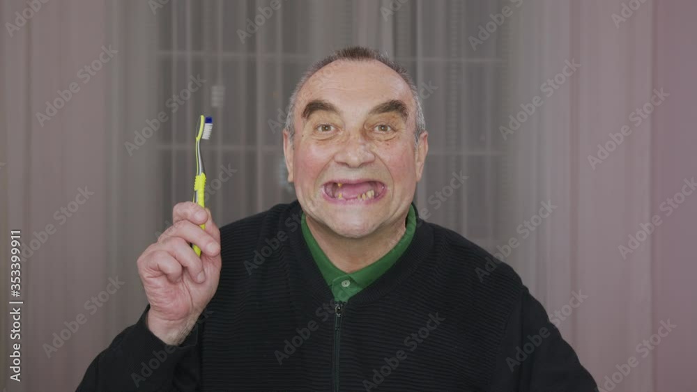 A man with bad teeth.A man with an ugly smile smiles. A man shows his ...