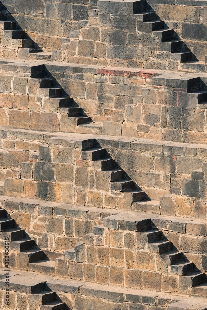 .Perspective background of stone stairs of Chand Baori Step Well in ...