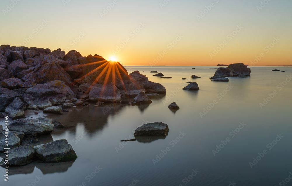 Southern coast of Finnish Gulf. Granite rocks piled. Sunrise time, star ...