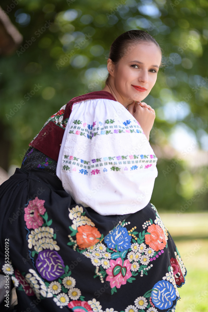 Young beautiful slovak woman in traditional costume. Slovak folklore ...