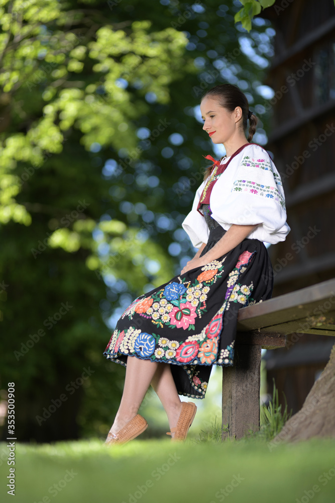 Young beautiful slovak woman in traditional costume. Slovak folklore ...