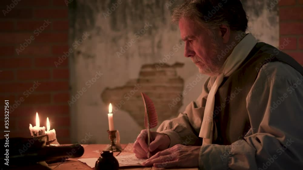 Scene from the 18th century of a bearded Caucasian man using a feather ...