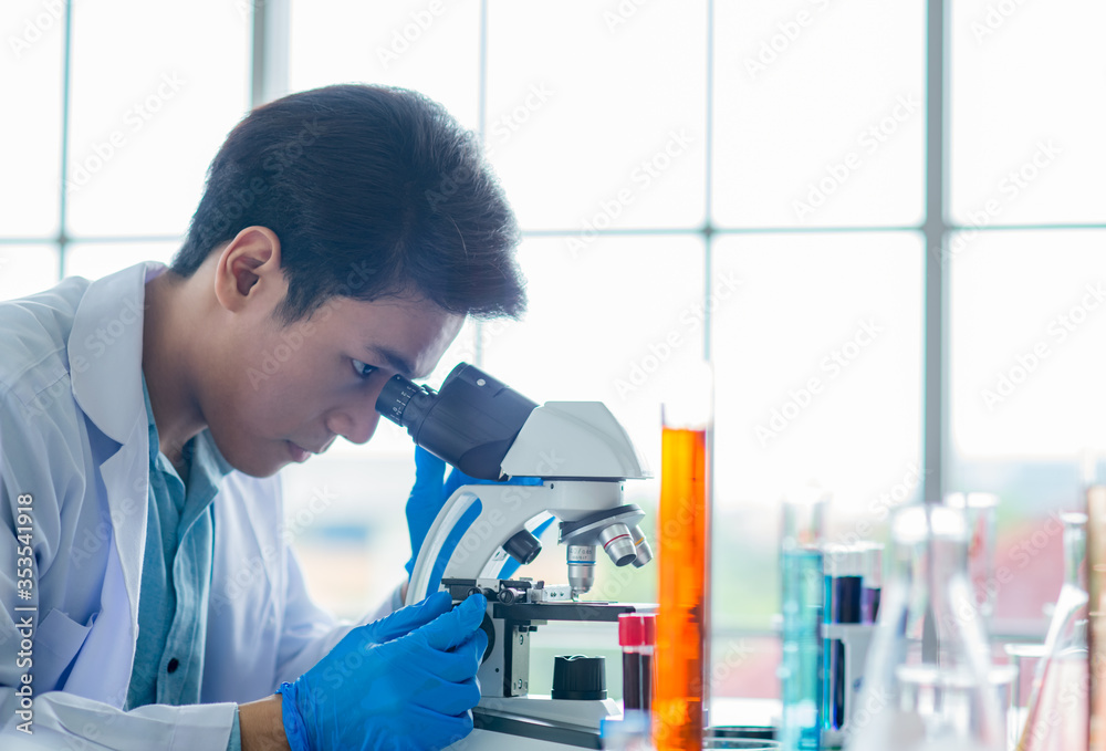 Professional Asian scientist or researcher man in work coat uniform ...