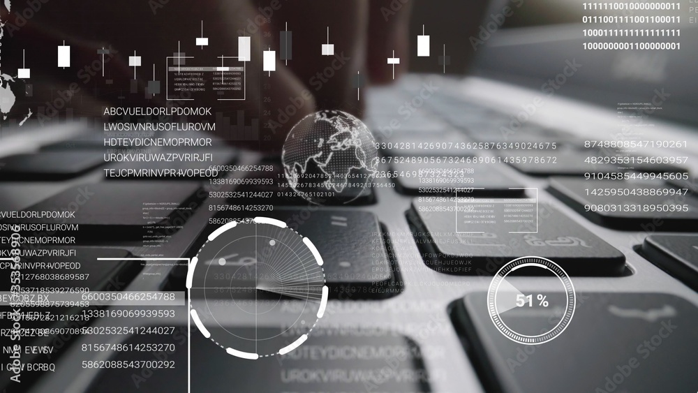 Man working on laptop computer keyboard with graphic user interface GUI ...