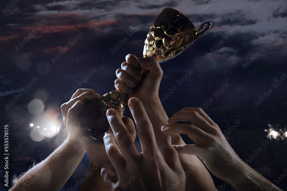 Leader way. Award of victory, male hands tightening the golden cup of ...