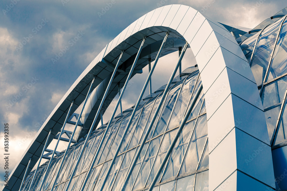 Fragment of an aboveground pedestrian crosswalk. Arched support beam of ...