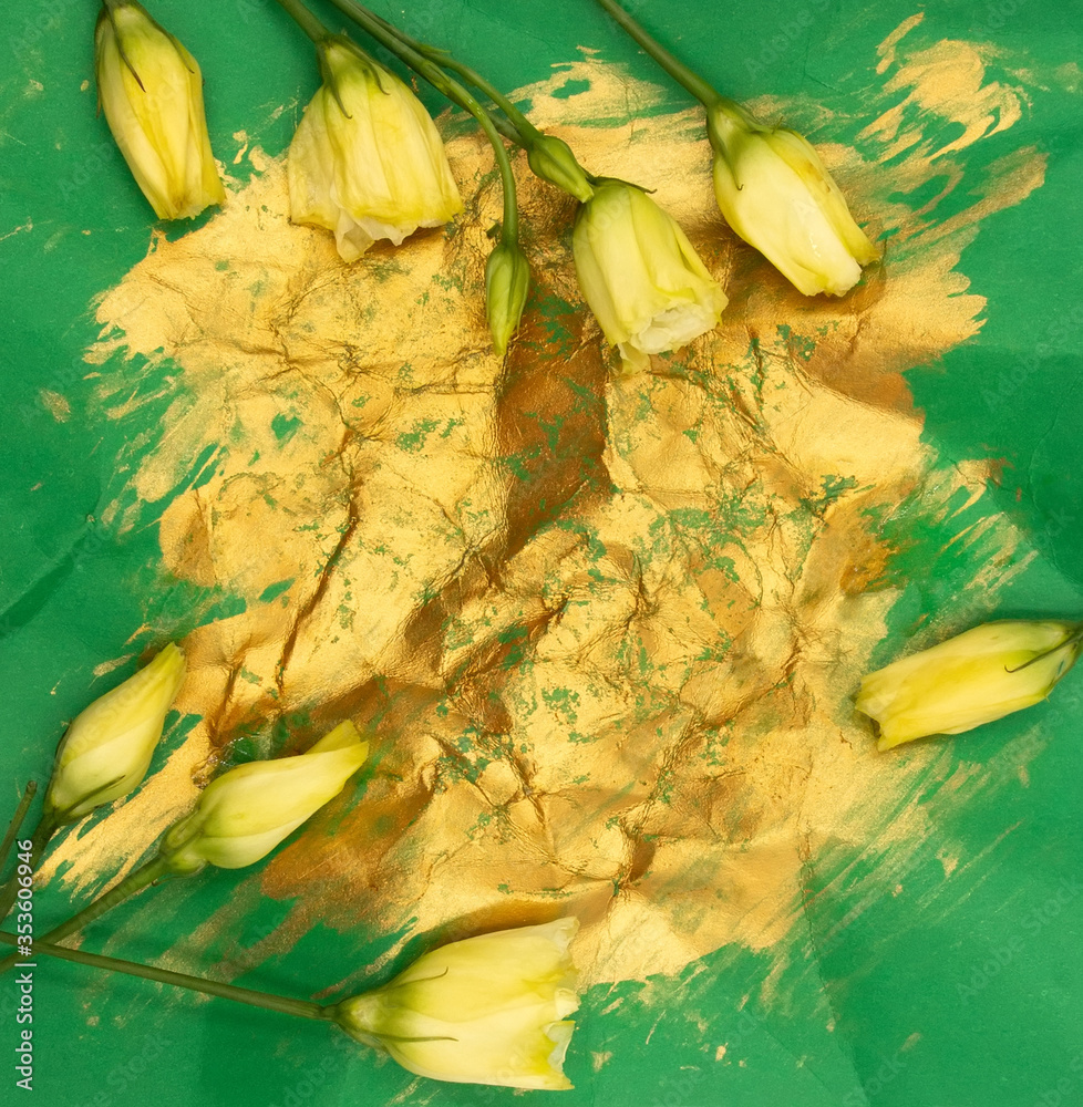 Yellow Eustoma tiny rose flower buds on crumpled paper with gold ...