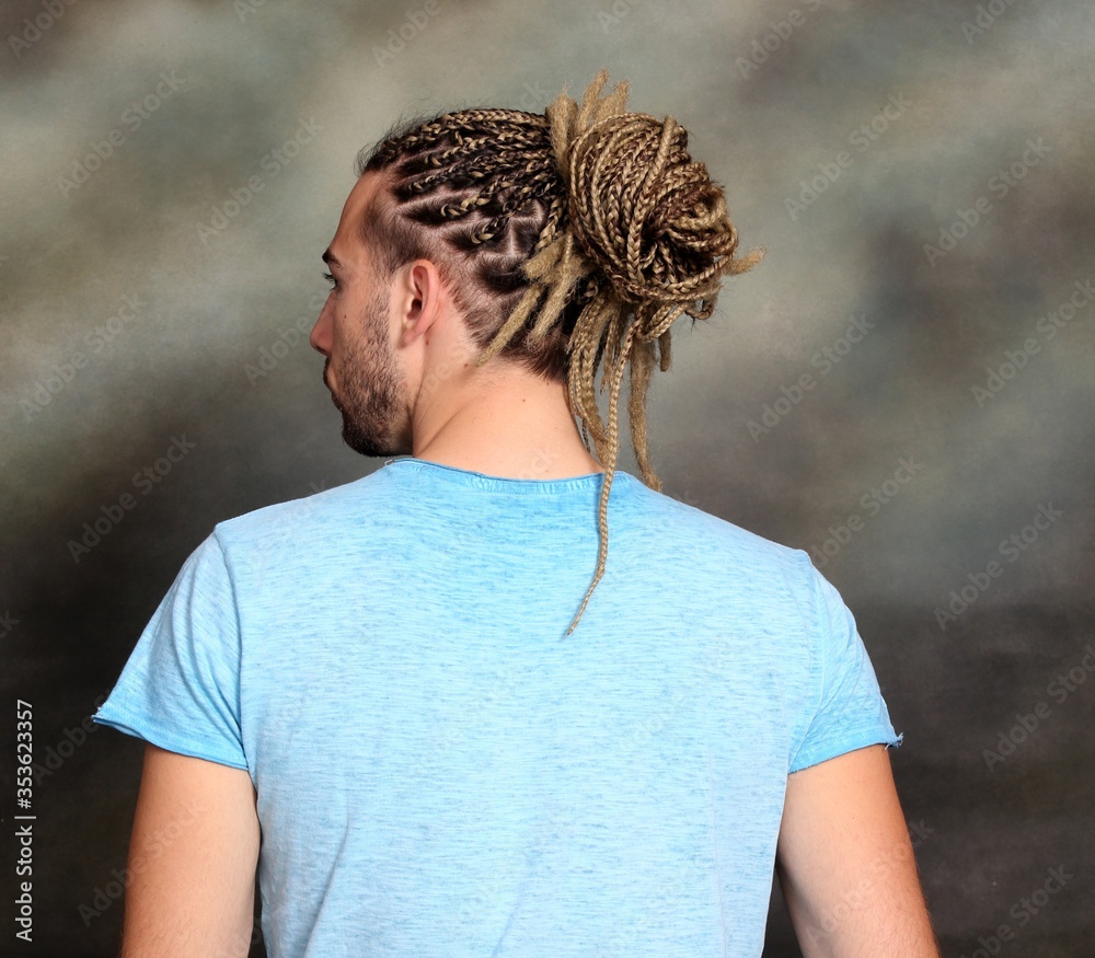 Attractive blonde male model with combination of braids and dreadlocks ...