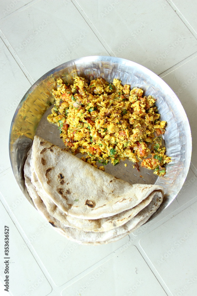 Egg paratha or egg Bhurji roti. A very Indian quick meal preparation ...