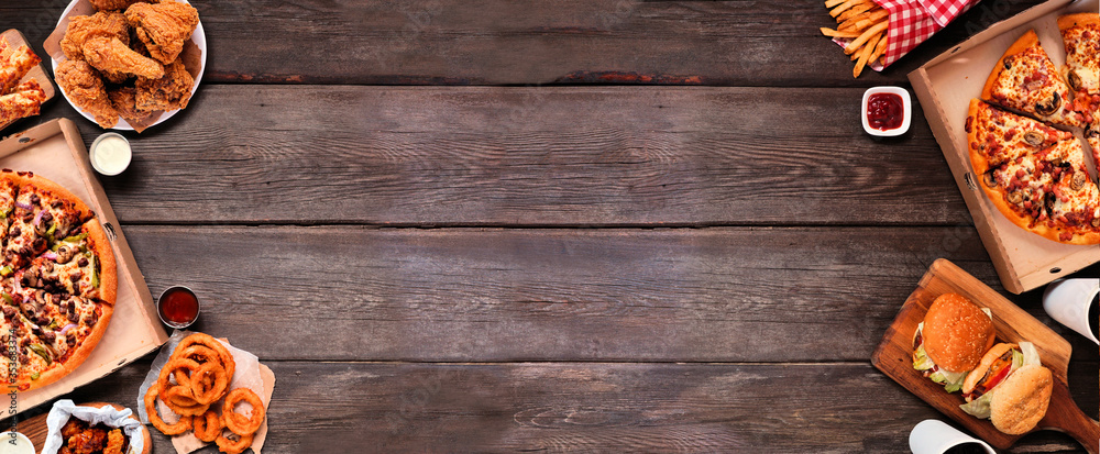 Assortment of take out or delivery foods. Pizza, hamburgers, fried ...