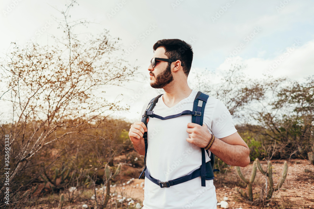 Young backpacker hiking in a semi-arid region of Brazil known as ...