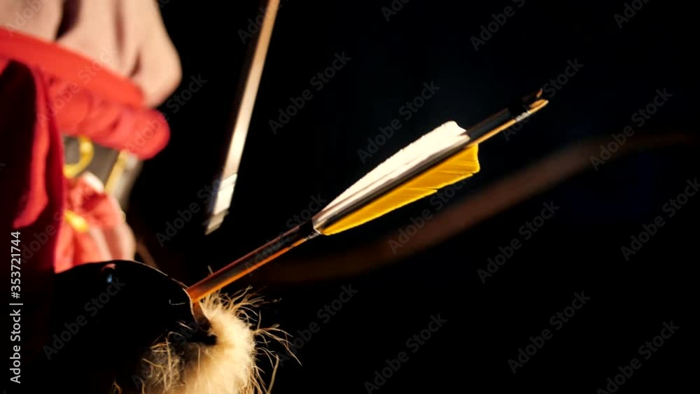 Two men are shooting arrows in a dark room. Archery. Historical Archery ...