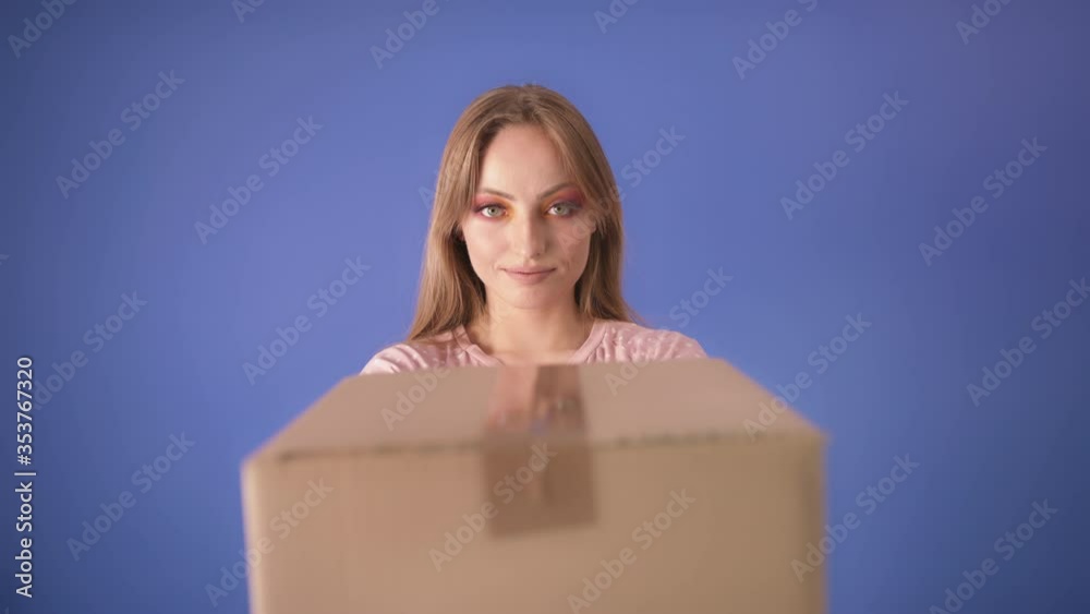 Woman hands holding and offering a cardboard box package in front of ...