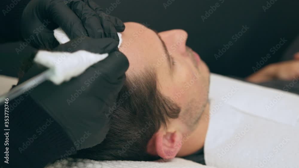 High quality close-up 4k slow motion video of a man laying on a couch ...