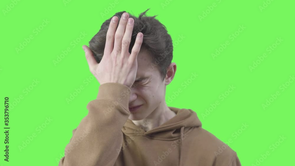 Close-up of boy making facepalm gesture. Portrait of shocked Caucasian ...
