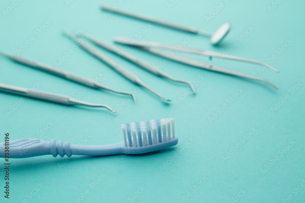 Dentist tools close-up. Professional steel dental instruments with a ...