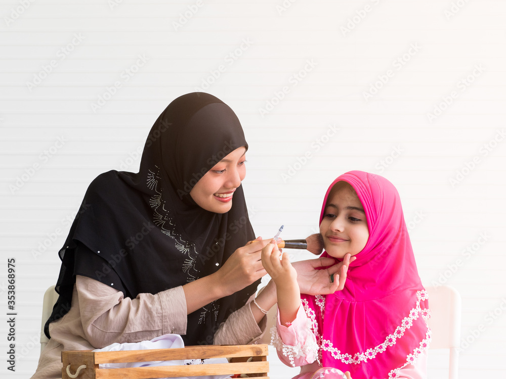 Muslim woman, mother or sister and little girl wearing traditional ...