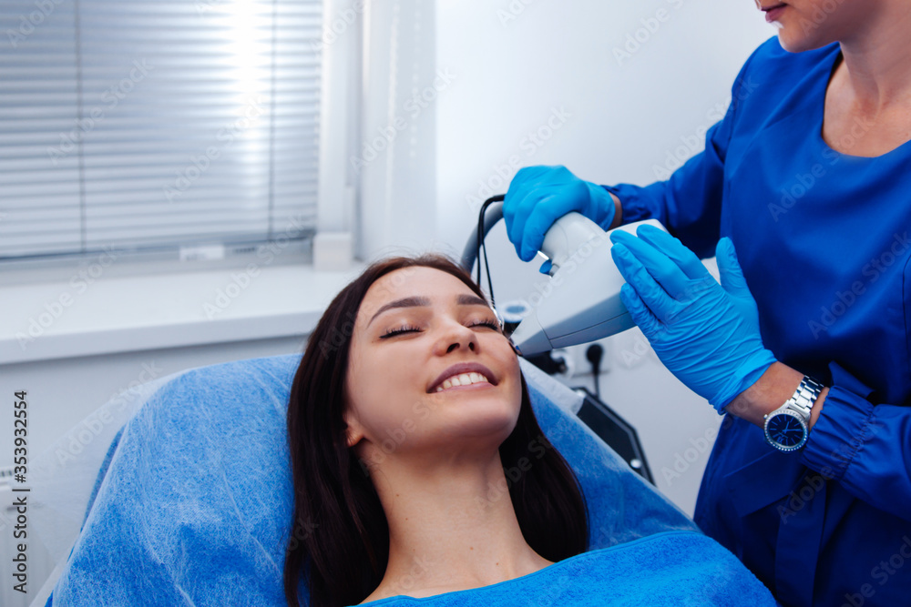 laser rejuvenation of the skin on the face of a girl with a smile Stock ...