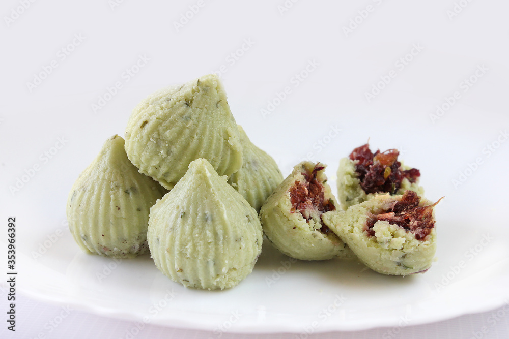 Modak [ladoo]or ladu is Indian traditional sweet dish made from khoya ...