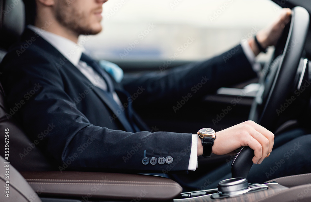 Confident man wearing suit and watch driving car Stock Photo | Adobe Stock
