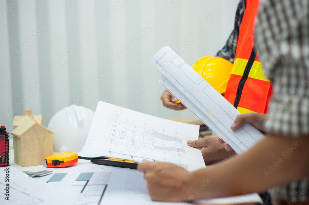 Engineers work on the design inspection of structural drawings of ...