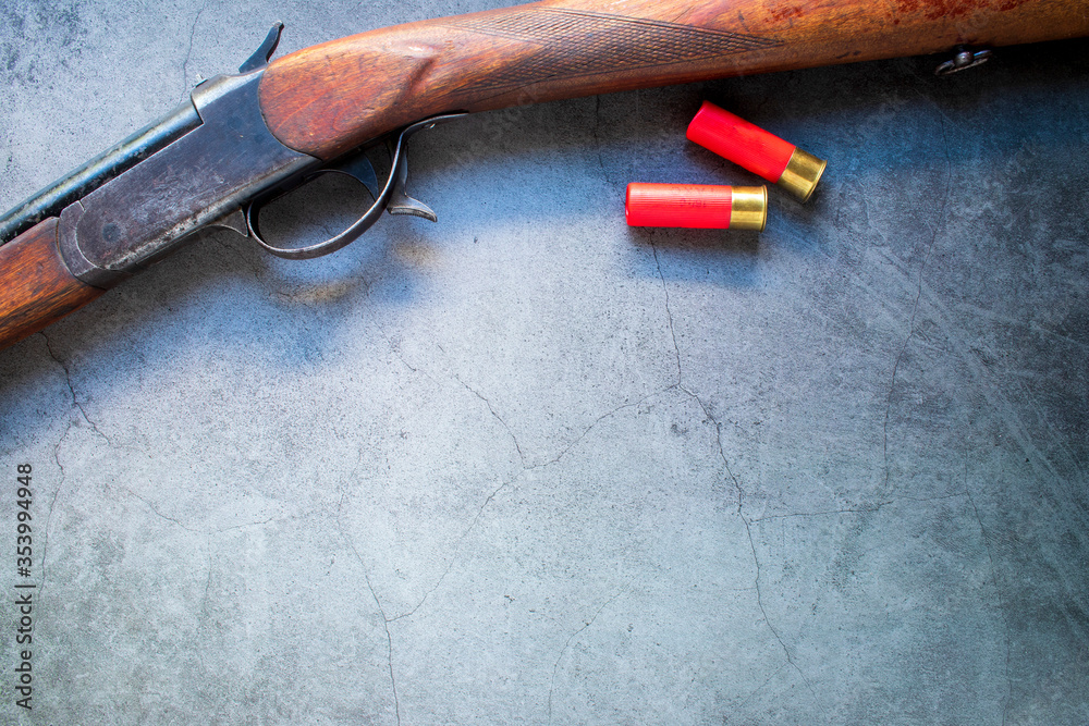 Old hunting rifles and ammunition on a dark background with a top view ...