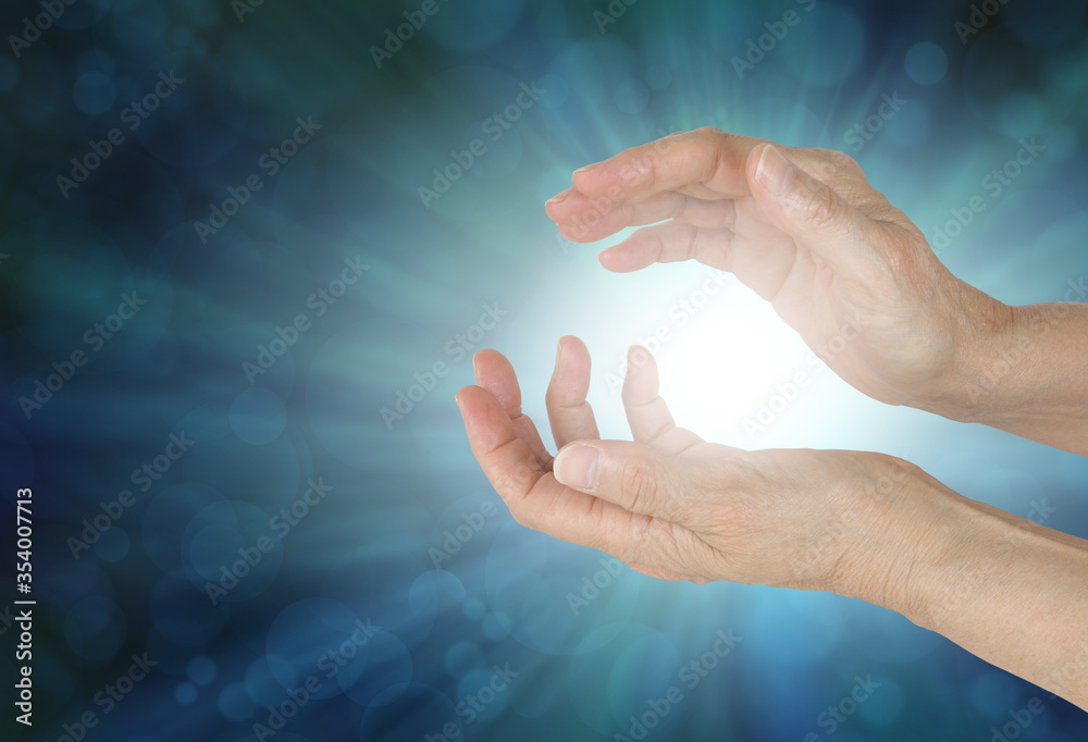 Female hands sensing Quantum Energy Field - female hands cupped around ...