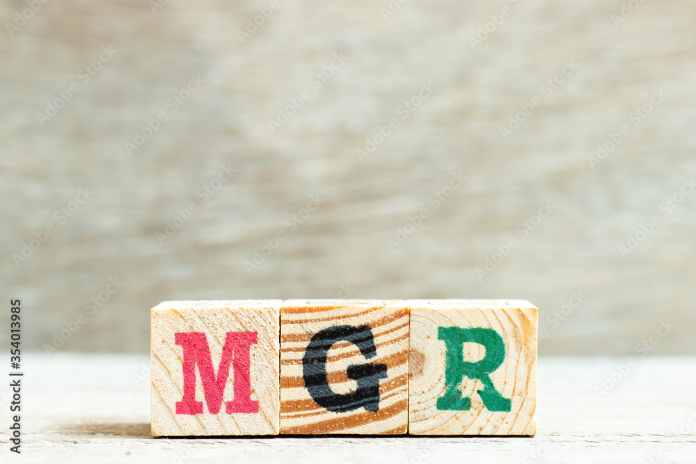Alphabet letter in word mgr (abbreviation of manager) on wood ...