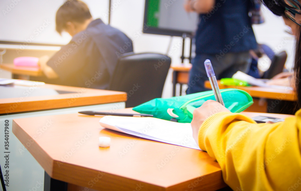 Hands university student holding pen writing /calculator doing ...