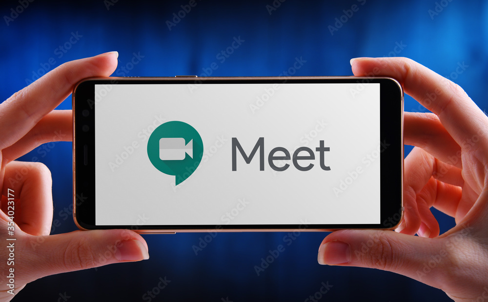 Hands holding smartphone displaying logo of Google Meet Stock Photo ...