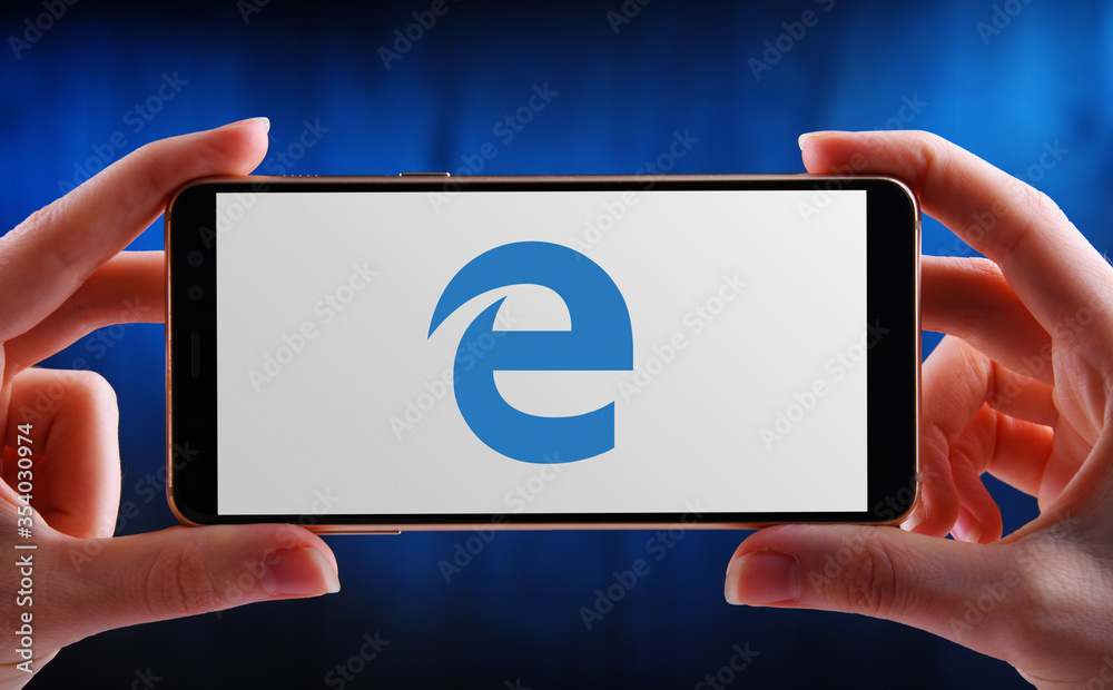 Hands holding smartphone displaying logo of Microsoft Edge Stock Photo ...