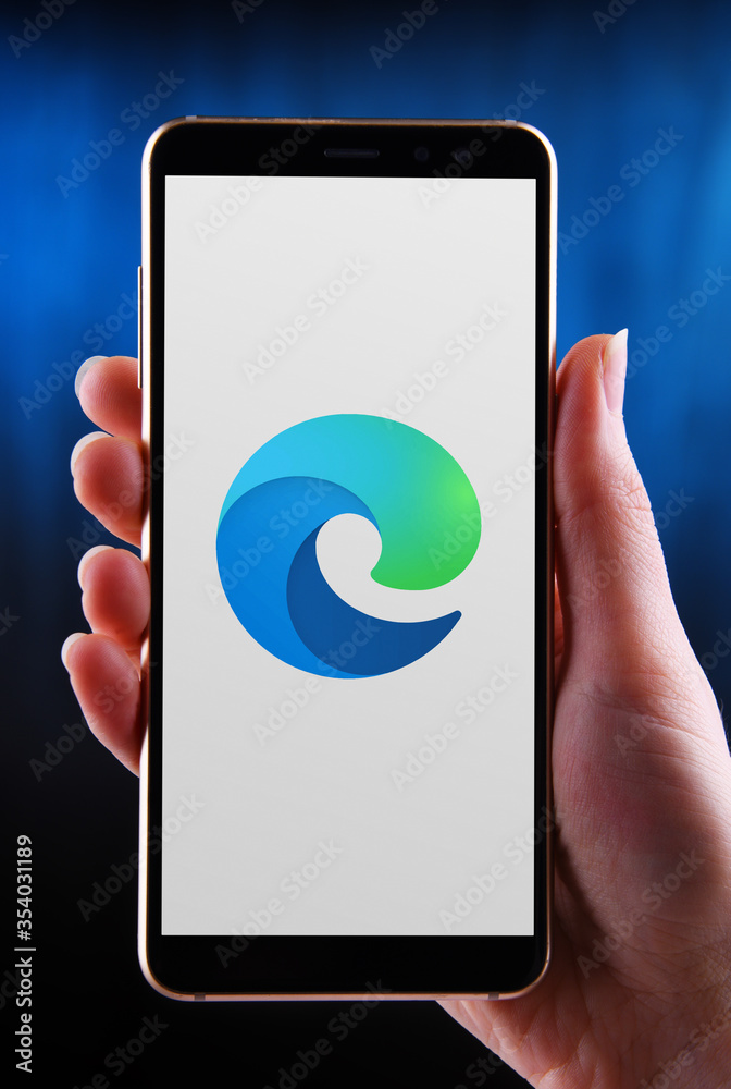 Hands holding smartphone displaying logo of Microsoft Edge Stock Photo ...
