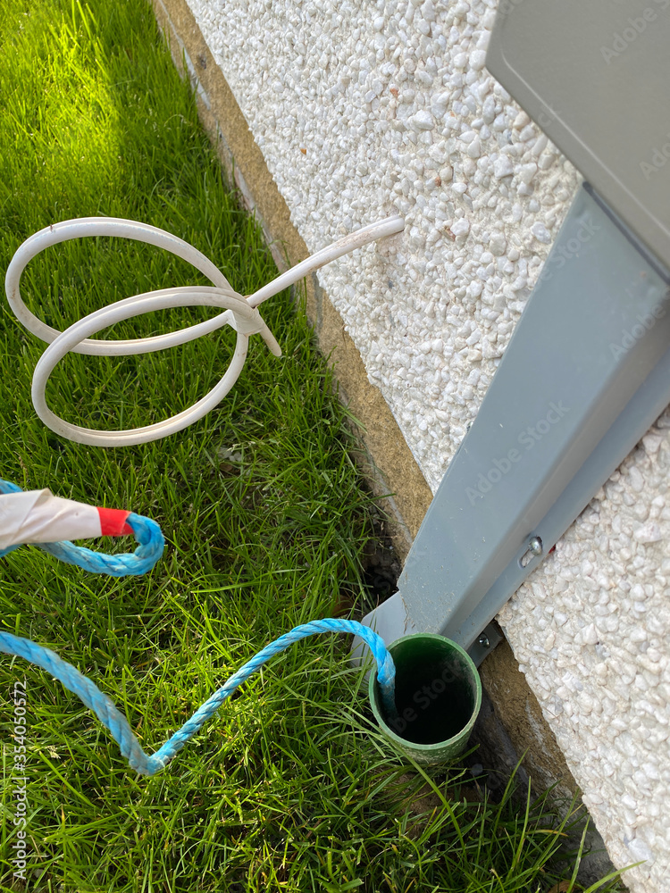 Broadband fibre cable entering new construction of house Stock Photo ...