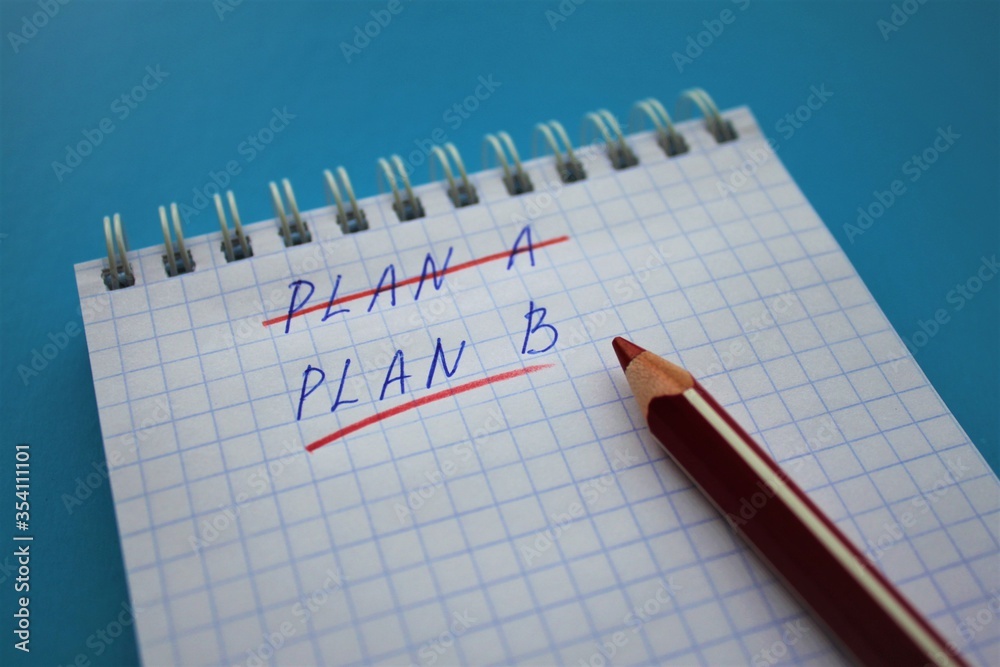 In a spiral notebook in a cell crossed out with a red pencil Plan A ...